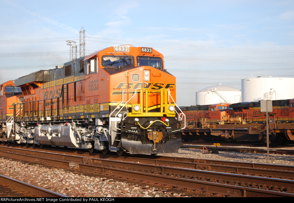 Close in shot of A Very, Very Brand New BNSF 6833 as she Heads East at Sunrise thru BNSF ...